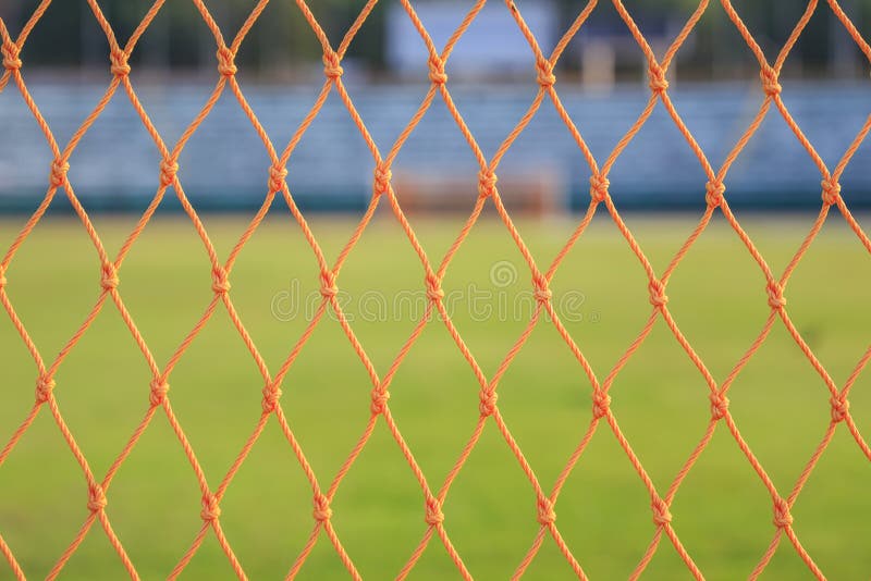 Orange Soccer Net on Green Grass Background Stock Photo - Image of ...