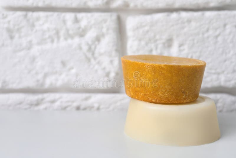 Orange Solid Shampoo Bars on White Table, Closeup. Space for Text Stock ...