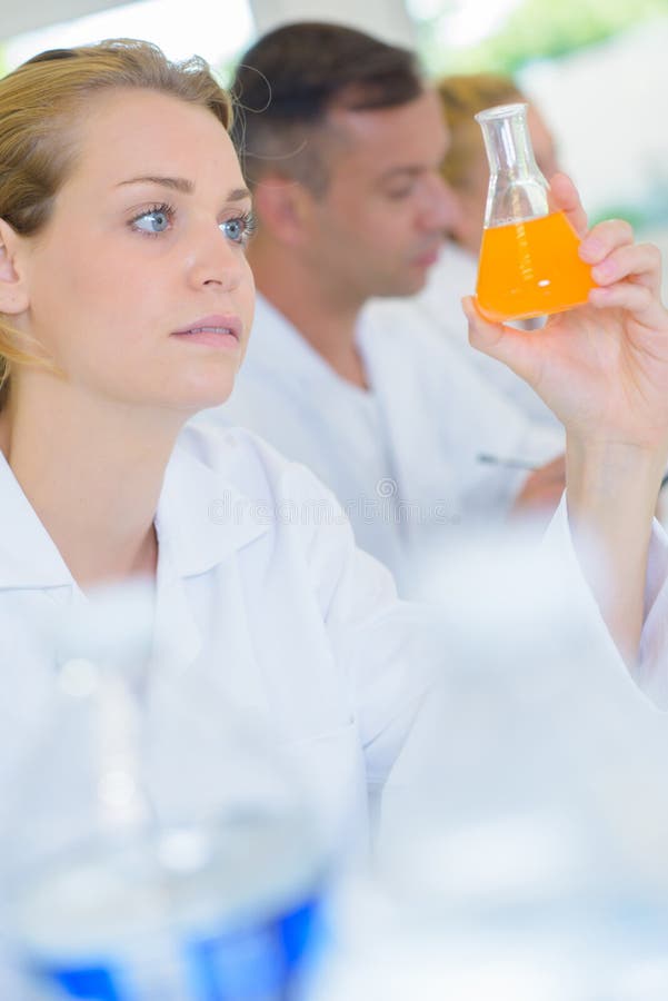 Orange solution in lab stock image. Image of result - 132212969