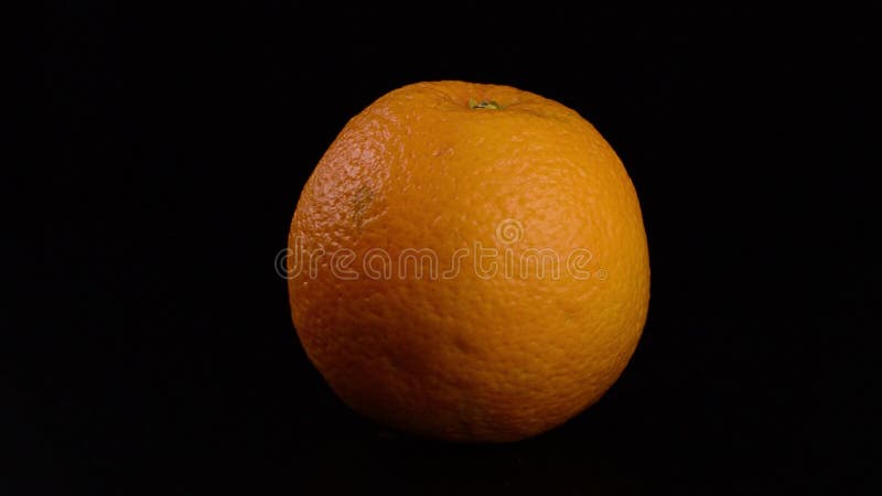 Orange Spinning on a Black Background Stock Footage - Video of color ...