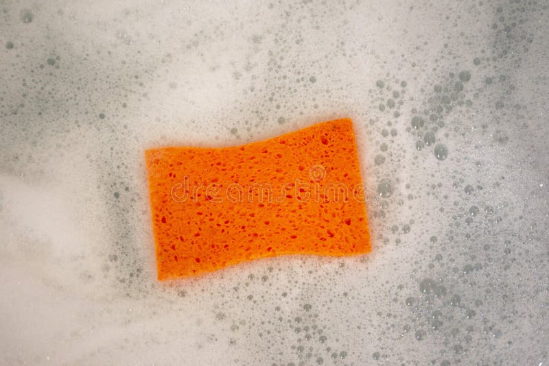 Orange Sponge Inside the Bathtub with Soap and Water Stock Photo ...
