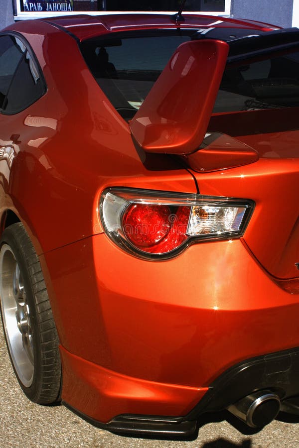 Orange sport car stock photo. Image of moving, back, colors - 88064802