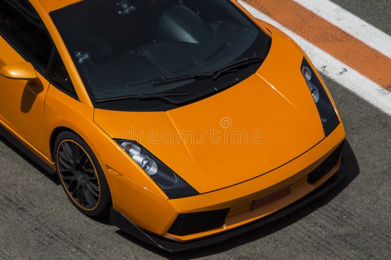Orange sport race car editorial photo. Image of asphalt - 130816071