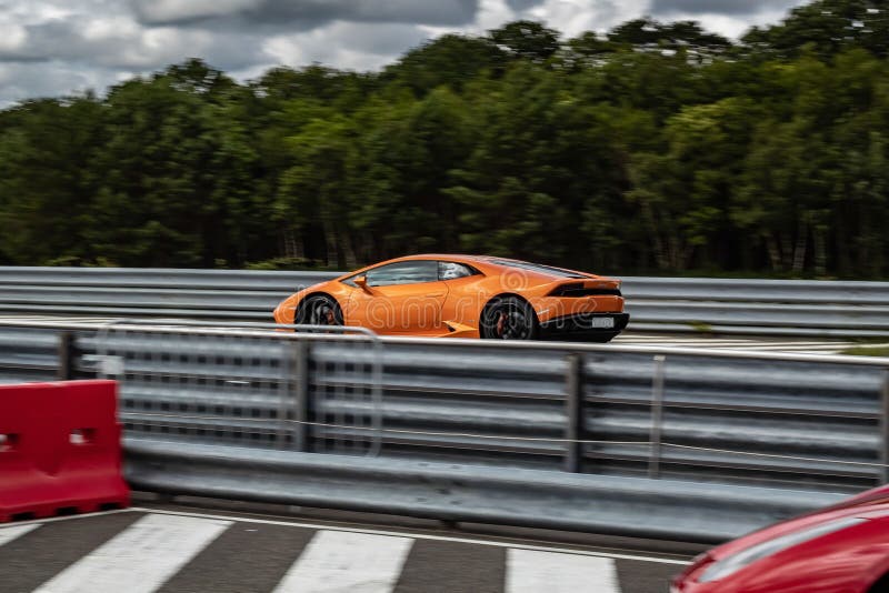 Orange Sports Car Driving Fast on the Highway Editorial Photography ...