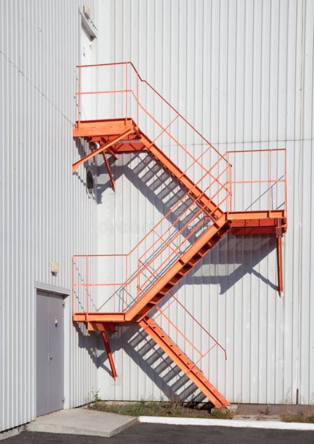 Orange Stairs on the White Wall Stock Image - Image of railing, ladder ...