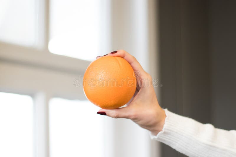 Orange Standing in Woman`s Hand, on Background Stock Image - Image of ...