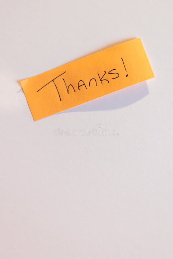 An Orange Sticky Note with the Word "thanks" Written on it Stock Image ...