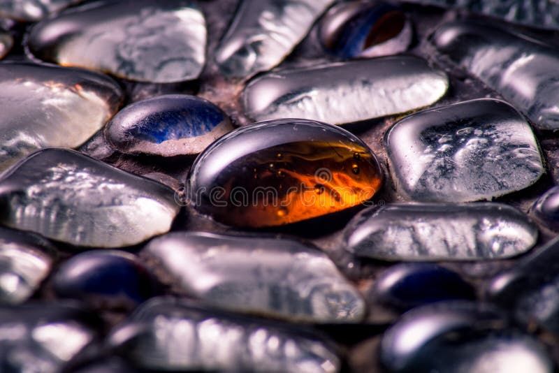 Orange Stone Focus between Other White Stones Stock Image - Image of ...