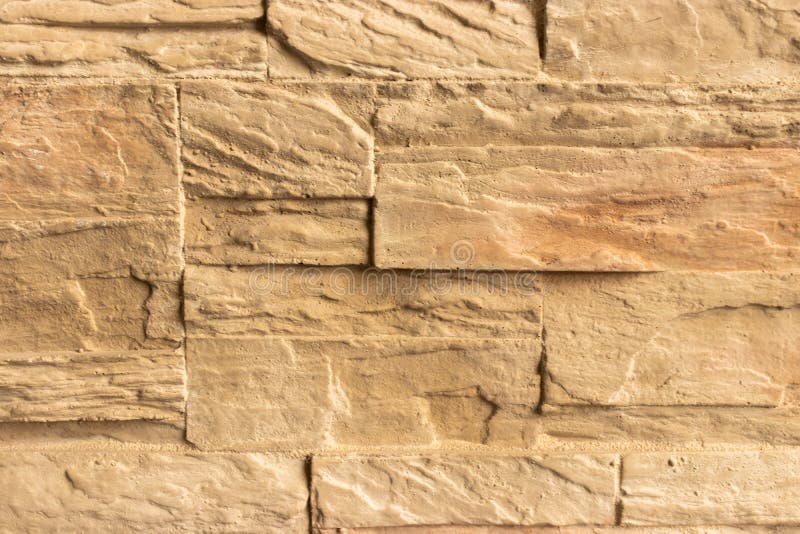 Orange stone grain wall stock photo. Image of rock, hard - 259704674