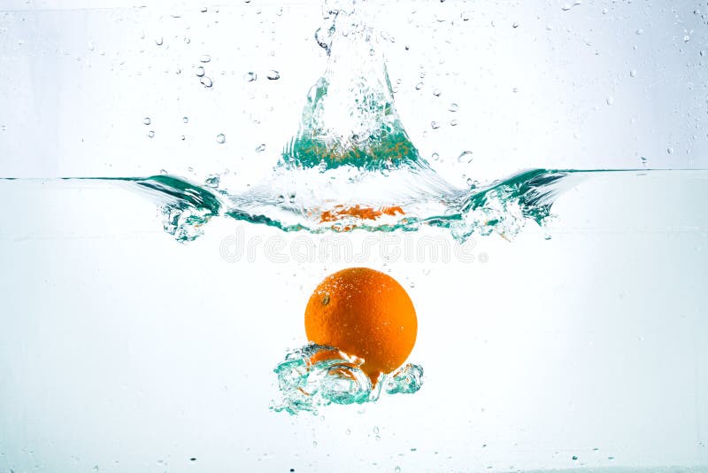 Orange in Streams of Water on a White Background Stock Photo - Image of ...