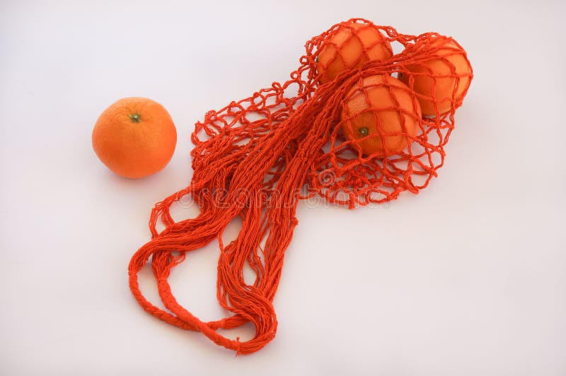 Orange string bag stock photo. Image of agriculture - 149300446