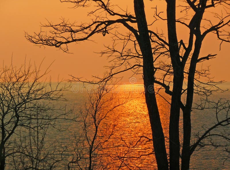 Setting Sun Casting Glow Over Beach Scene. Stock Image - Image of grass ...