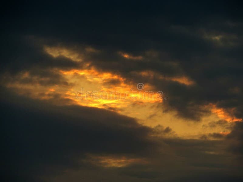 Orange Sunlight Shining through the Night Clouds Stock Photo - Image of ...