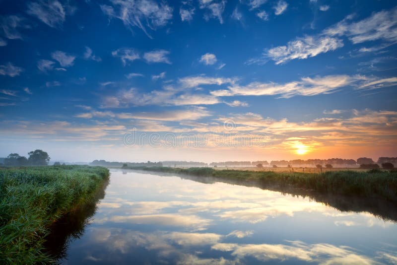 Orange Sunrise Over Wide River Stock Photo - Image of reflect, canal ...