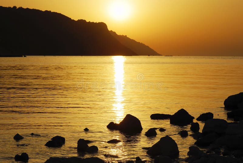 Orange sunset on the beach stock image. Image of space - 12290311