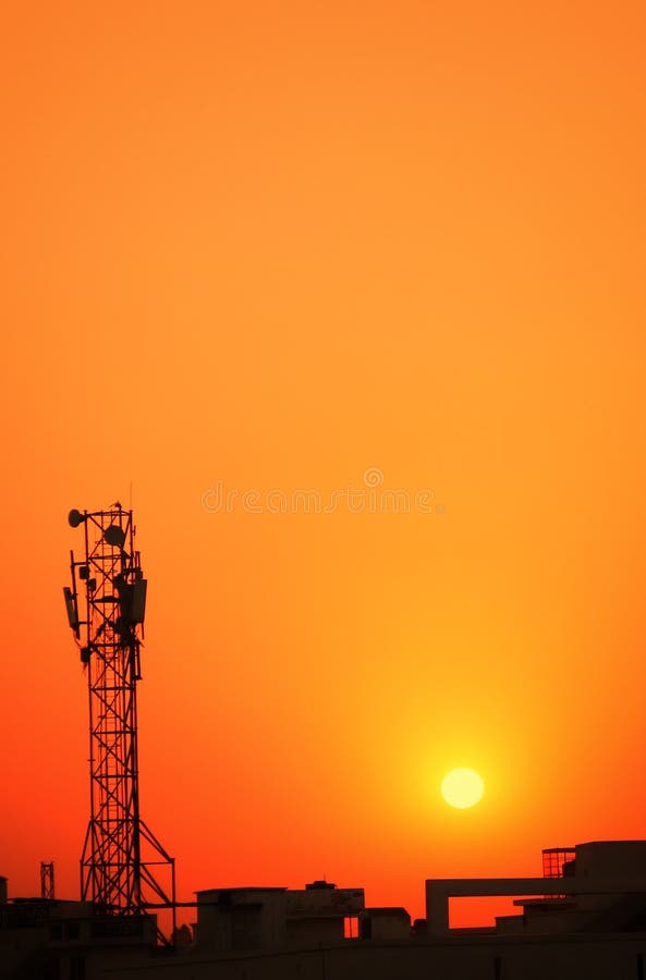 Orange Sunset Having Radio Tower and Shadow of Houses Stock Image ...