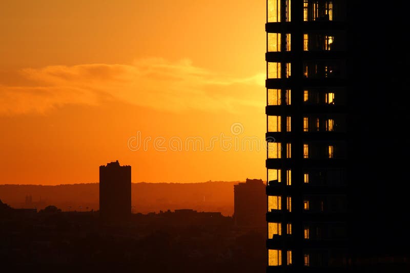 The Orange Sunset and the High Rise Buildings Stock Photo - Image of ...