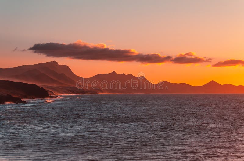 Orange Sunset. Ocean Landscape. Rocks and Wave of Ocean Stock Photo ...