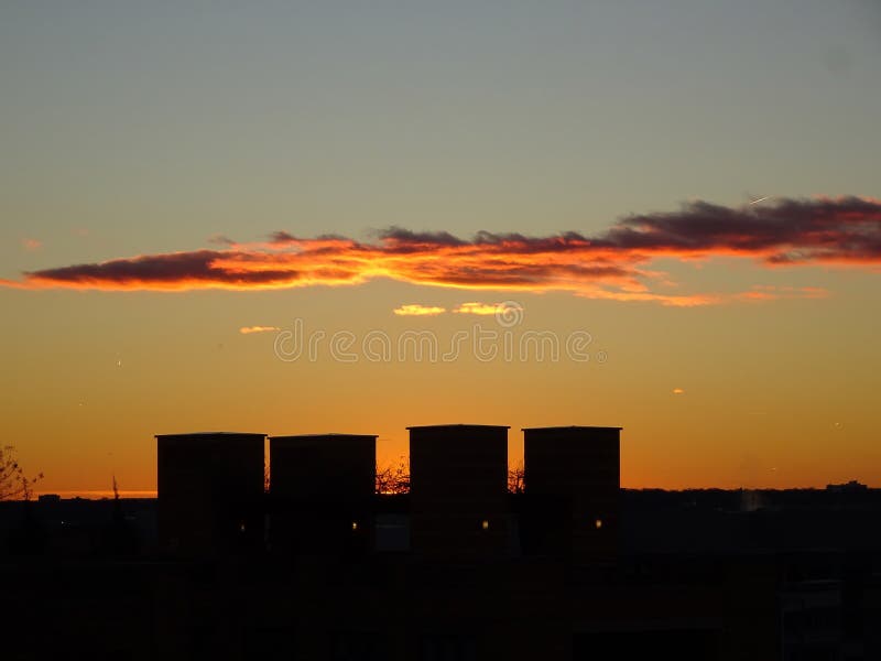 Orange Sunset Over Building Rooftops in a City Stock Photo - Image of ...