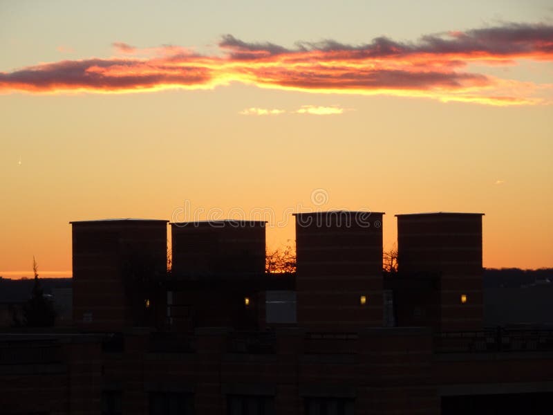Orange Sunset Over Building Rooftops in a City Stock Photo - Image of ...