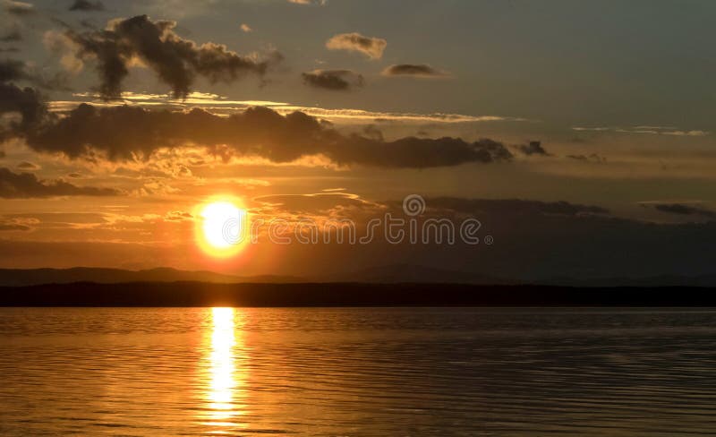 Orange sunset over lake stock image. Image of contour - 120794721