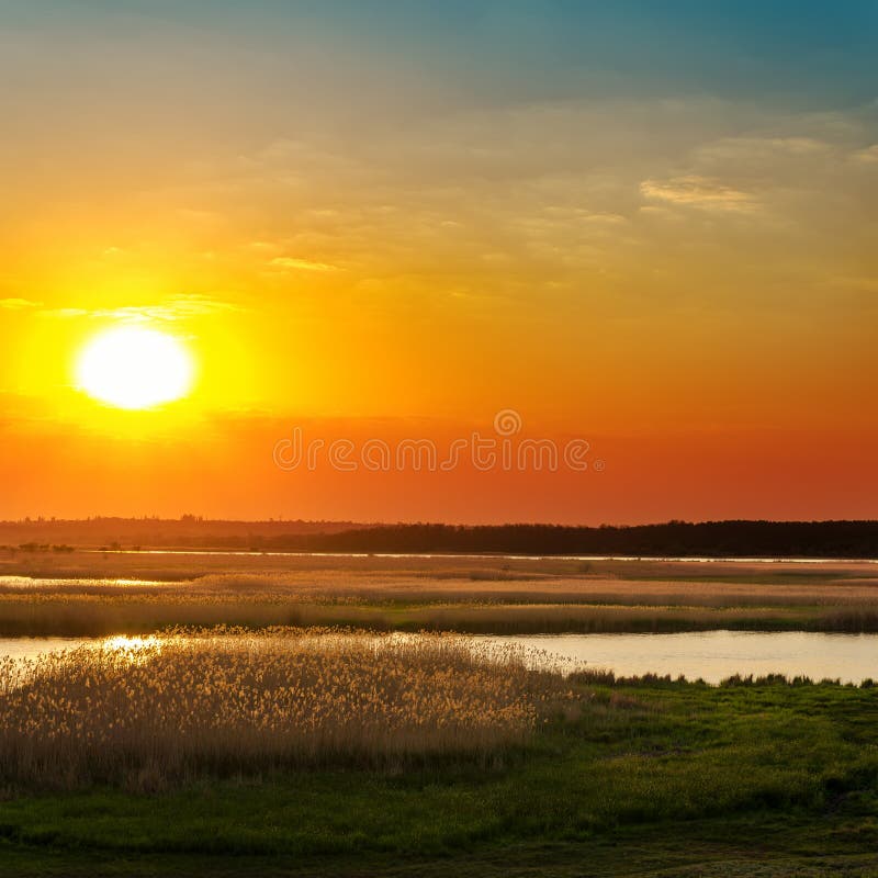 Orange sunset over river stock photo. Image of scenic - 28279308