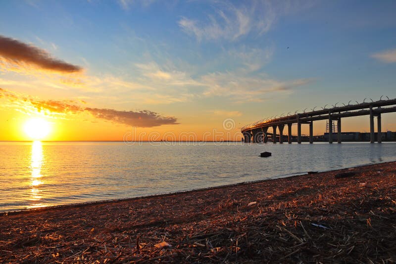Orange Sunset Over the River with a Highway Bridge Editorial Stock ...