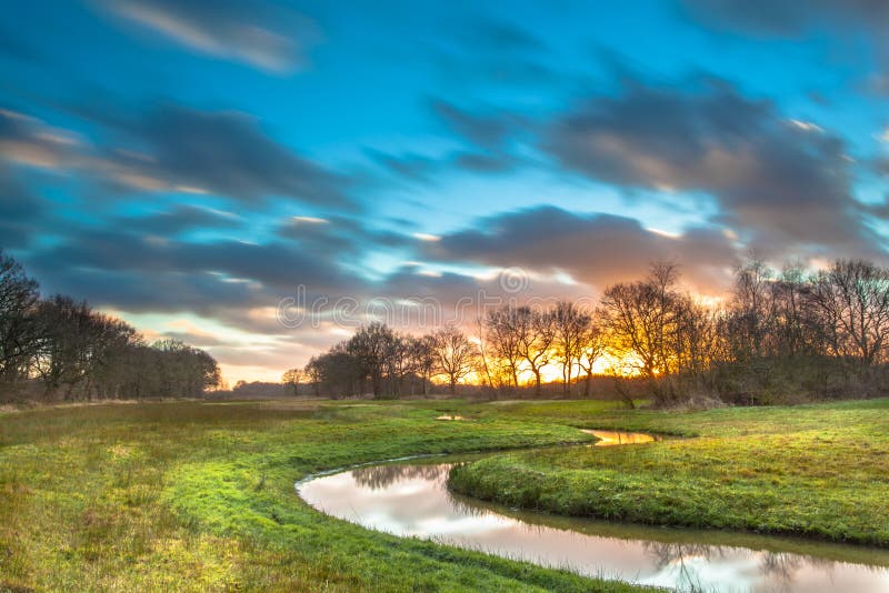 Orange Sunset Over River Valley Stock Photo - Image of evening, cloudy ...