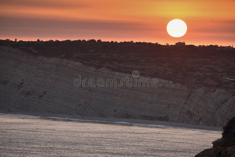 Orange Sunset Sky Over a Cliffed Coast Stock Image - Image of tide ...