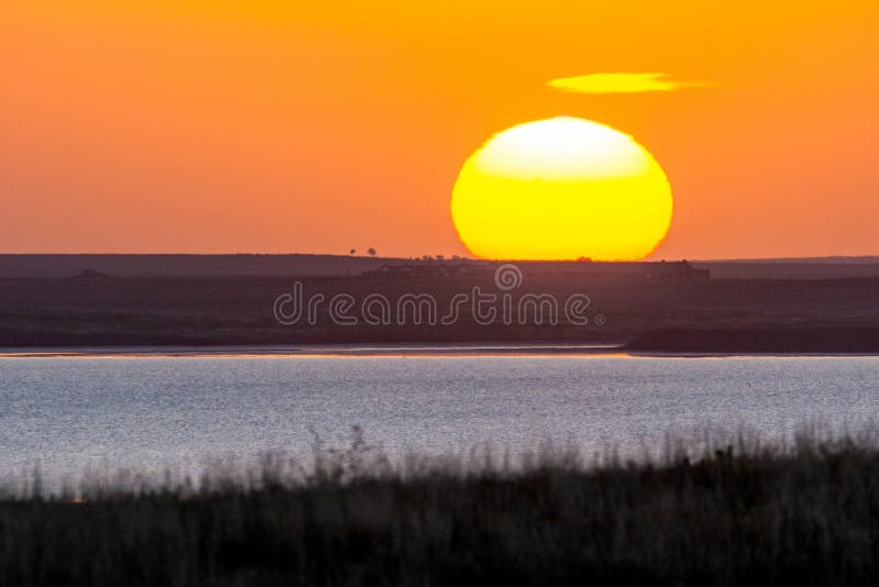 Orange Sunset with the Sun at the Horizon Setting Down Stock Photo ...