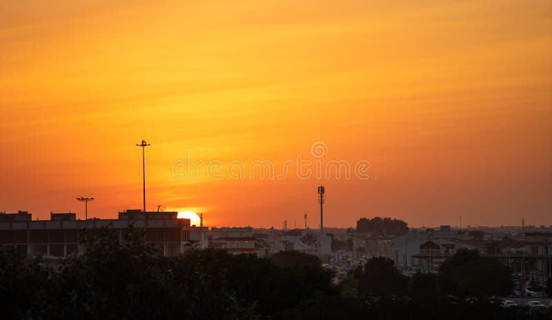 Orange Sunset. the Tree and Arabic City Against the Sun Disc. Stock ...