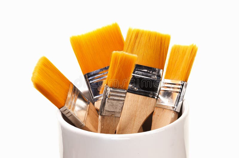 Orange Synthetic Brushes of Different Sizes in a Vertical Position ...