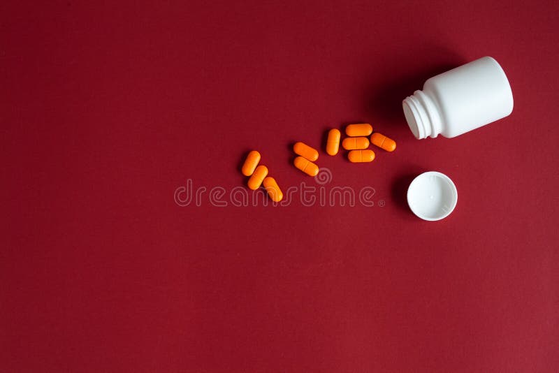 Orange Tablets in Plastic Container Top View Stock Photo - Image of ...
