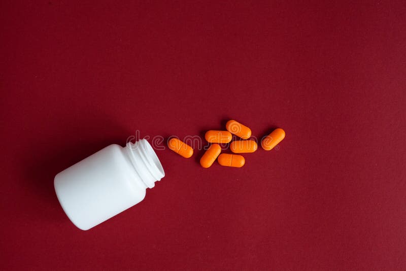 Orange Tablets in Plastic Container Top View Stock Photo - Image of ...