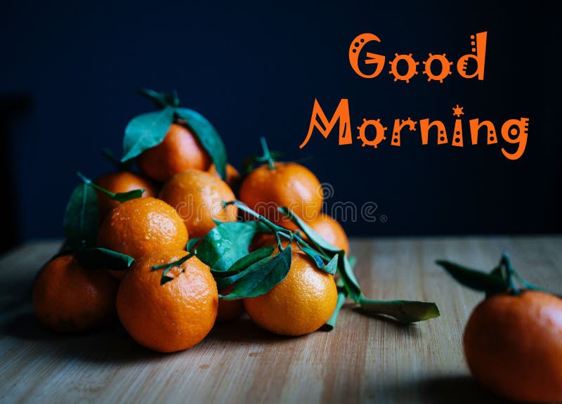 Orange Tangerines on the Table with the Text of the Greeting `Good ...