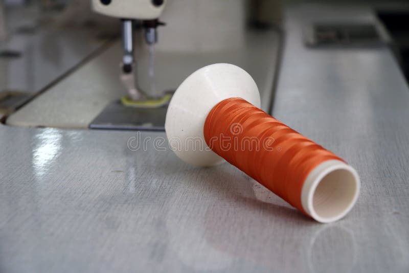 Orange Thread in the Thread Roll Put Horizontal on the Sewing Machine ...