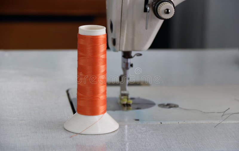 Orange Thread in the Thread Roll Put Vertical on the Sewing Machine ...