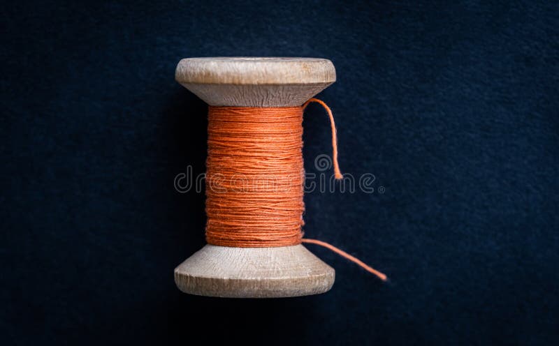 Orange Thread on Wooden Bobbin Stock Photo - Image of handmade, aged ...