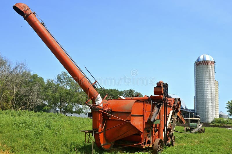 Orange Threshing Machine on Amish Farm Stock Photo - Image of farming ...