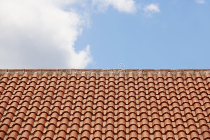 Orange Tile Roof Over a Blue Sky Stock Image - Image of roofs, exterior ...