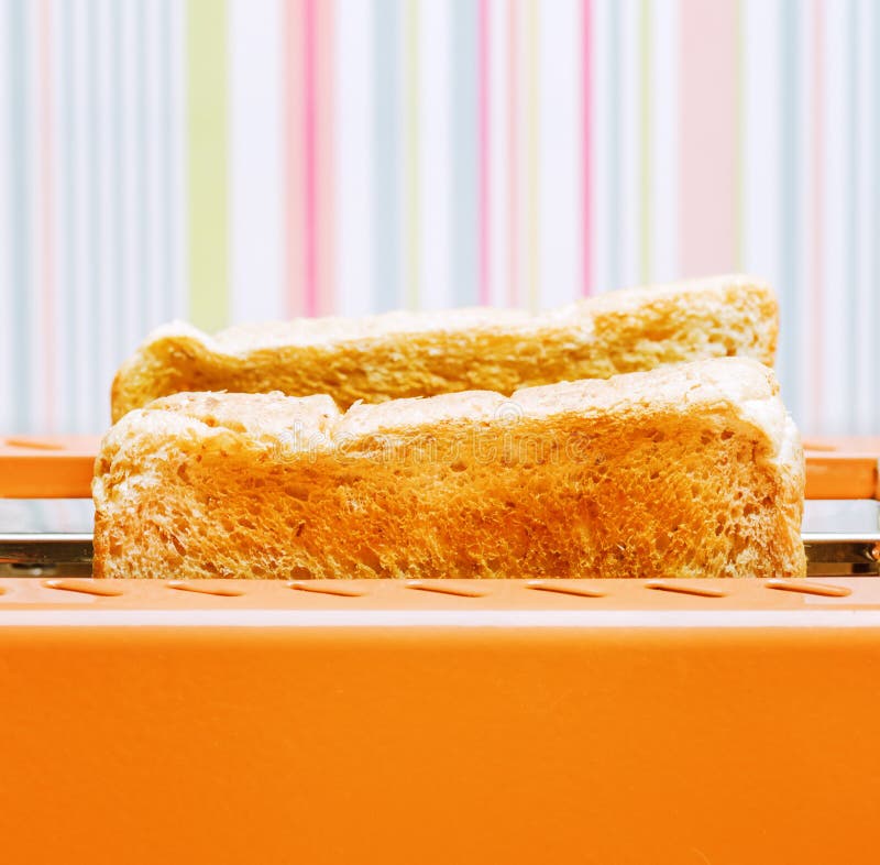 Orange Toaster with Two Slices of Bread Stock Photo - Image of slice ...