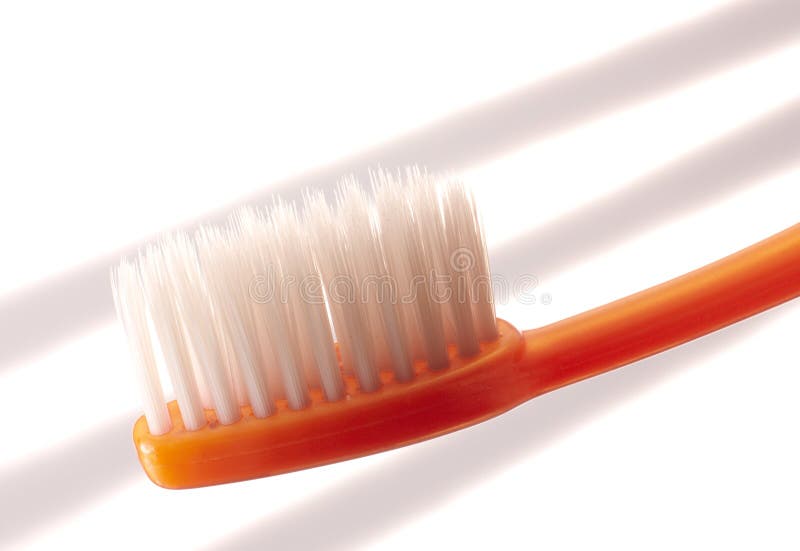Orange toothbrush stock photo. Image of healthcare, brush - 27311330