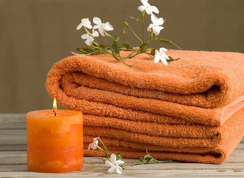 Orange towels with flowers stock image. Image of aromatherapy - 10102729