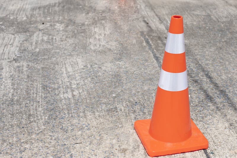 Orange Traffic Cone Set Up on a Brick Road Surface for Short Temporary ...