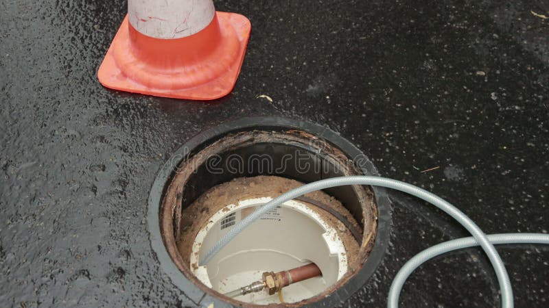 Orange Traffic Cones Standing in Row on Dark Asphalt. Open ...