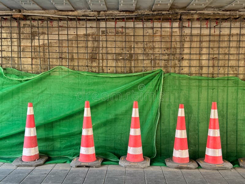 Orange Traffic Cones and Tarp Over Construction Wall Stock Image ...