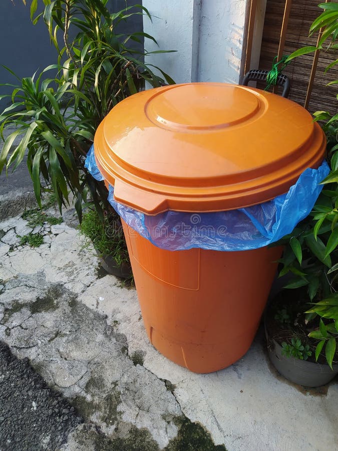 Orange Trash can stock photo. Image of clean, wheel - 323581320