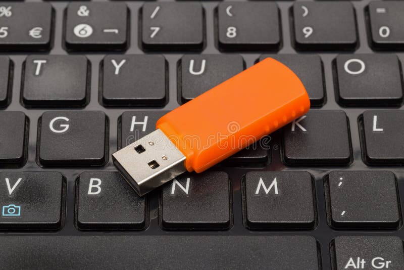 Orange USB Flash Drive on a Black Computer Keyboard Stock Photo - Image ...
