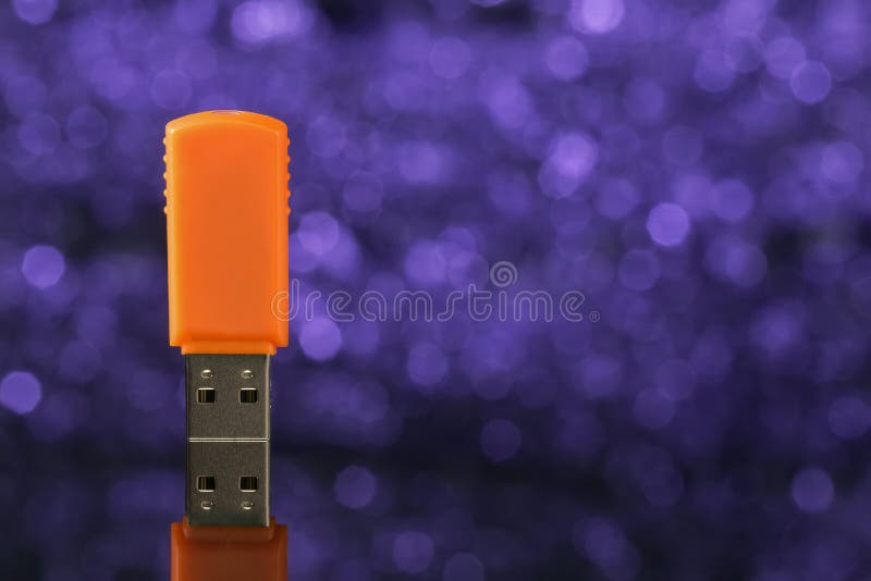Orange USB Flash Drive on Violet Background Out of Focus Stock Photo ...