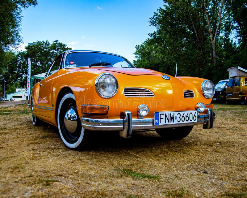 Orange Volkswagen Beetle Car on the Grass. Editorial Stock Image ...